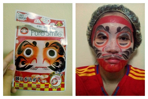 มีตุ๊กตาดารุมะติดบนหน้าหนู (Pure Smile Face Mask)
